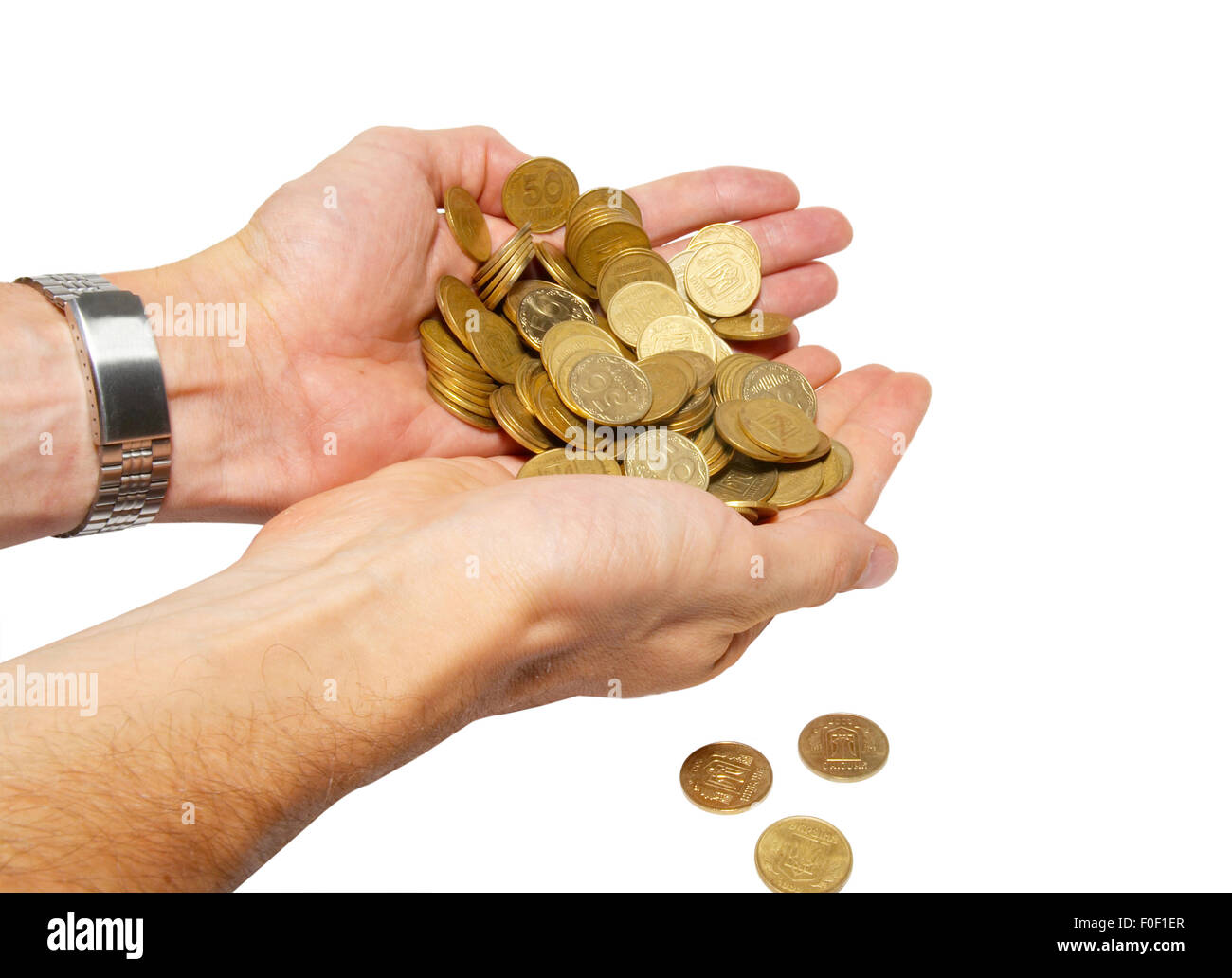 Gold in hands human coins hi-res stock photography and images - Alamy