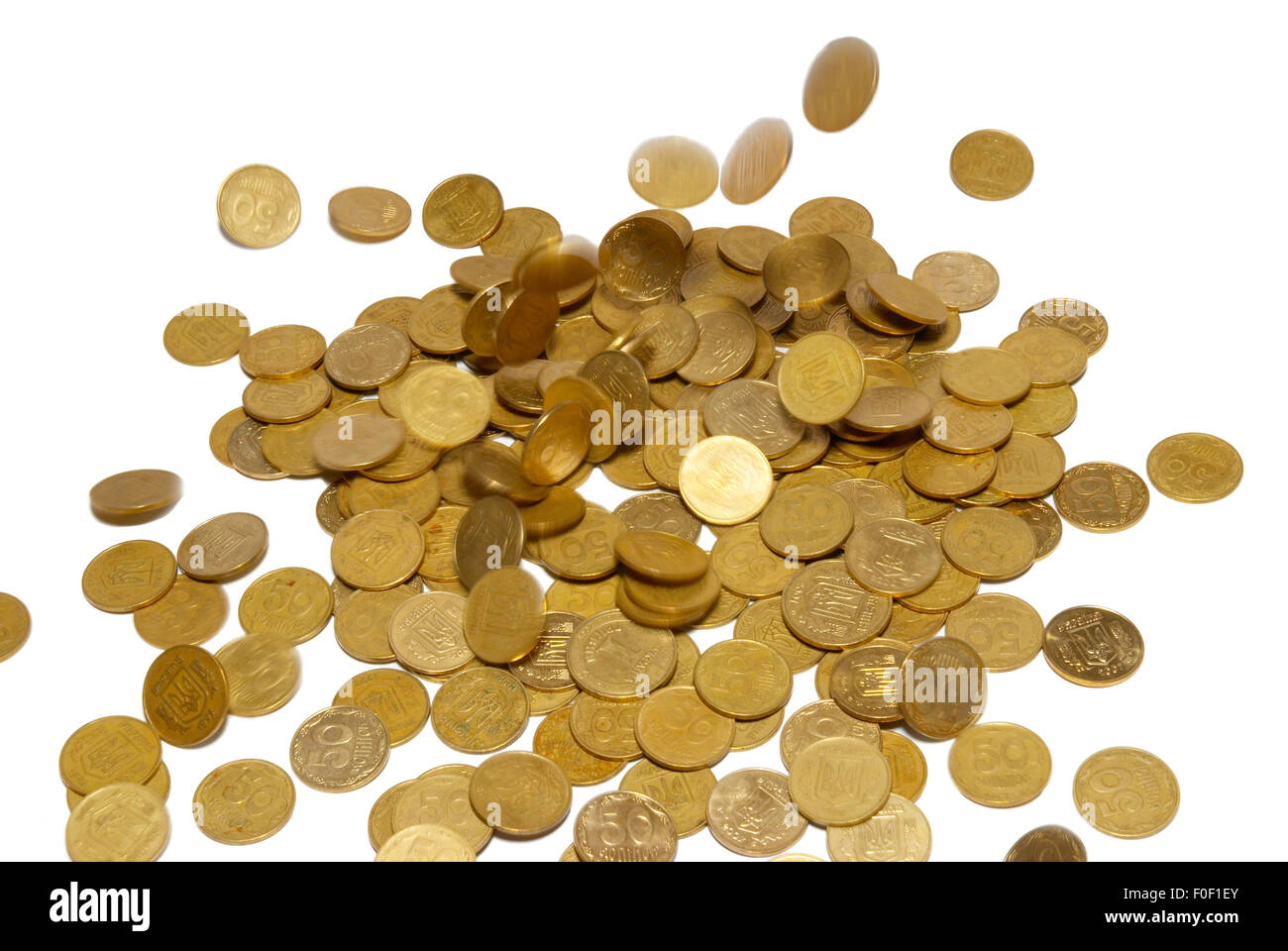 Rain of gold coins isolated on white Stock Photo - Alamy