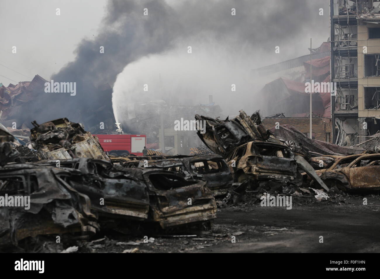 Tianjin, China. 14th Aug, 2015. Firefighters work at the warehouse ...