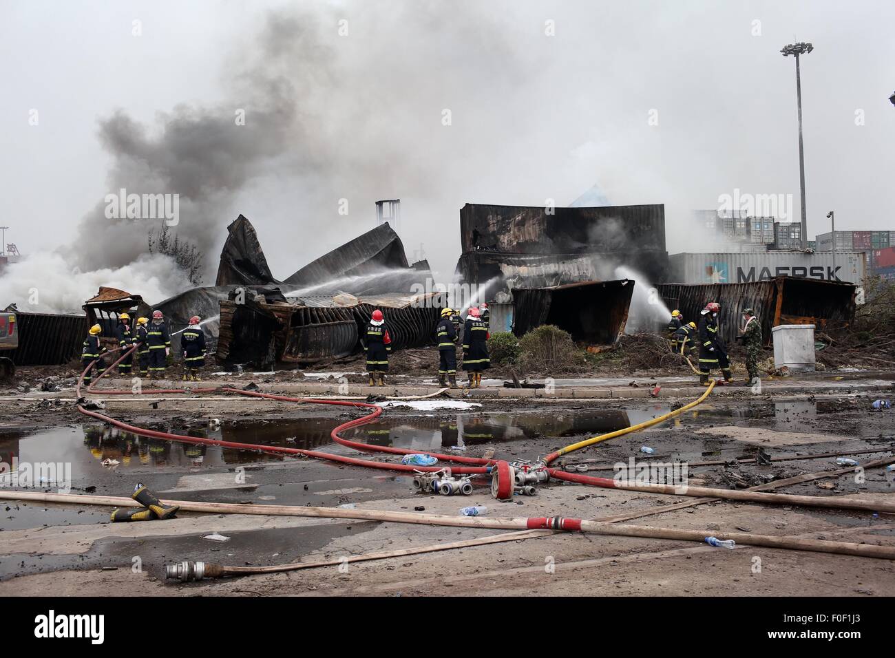 Tianjin, China. 14th Aug, 2015. Firefighters work at the warehouse ...