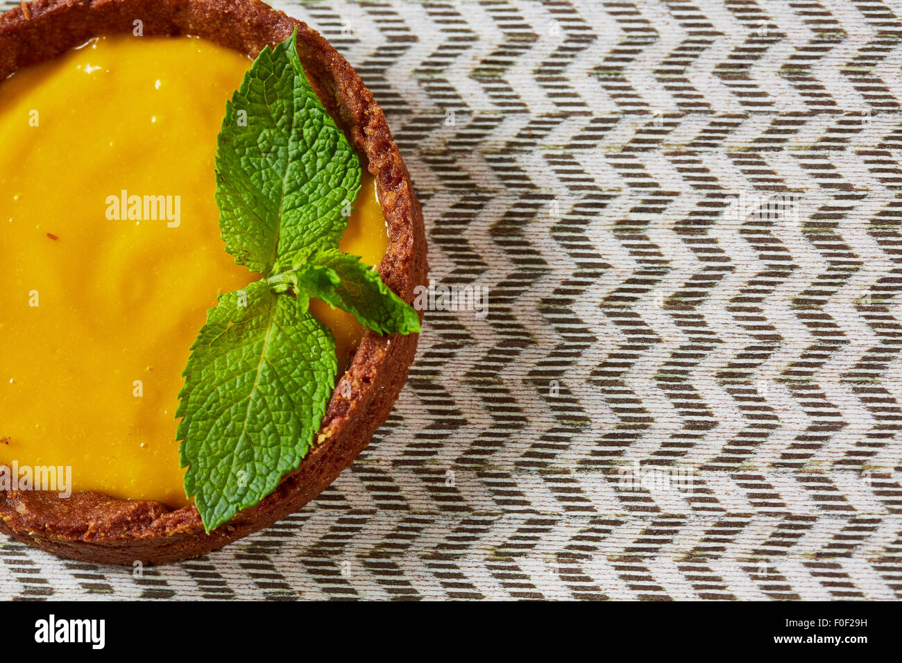 Sweet tartlets filled with cream. With copy space Stock Photo - Alamy