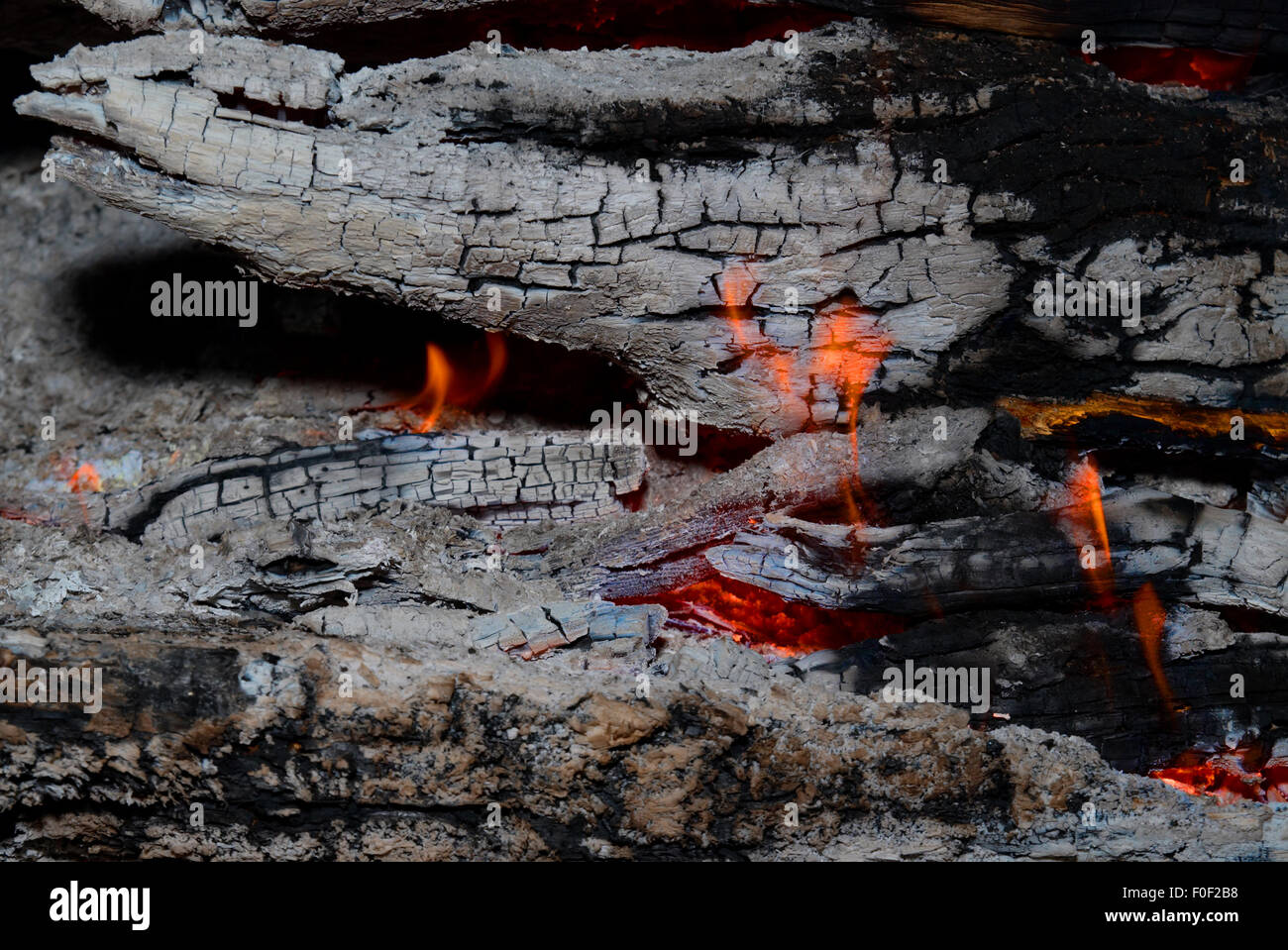 Flame tips on the firewood Stock Photo - Alamy