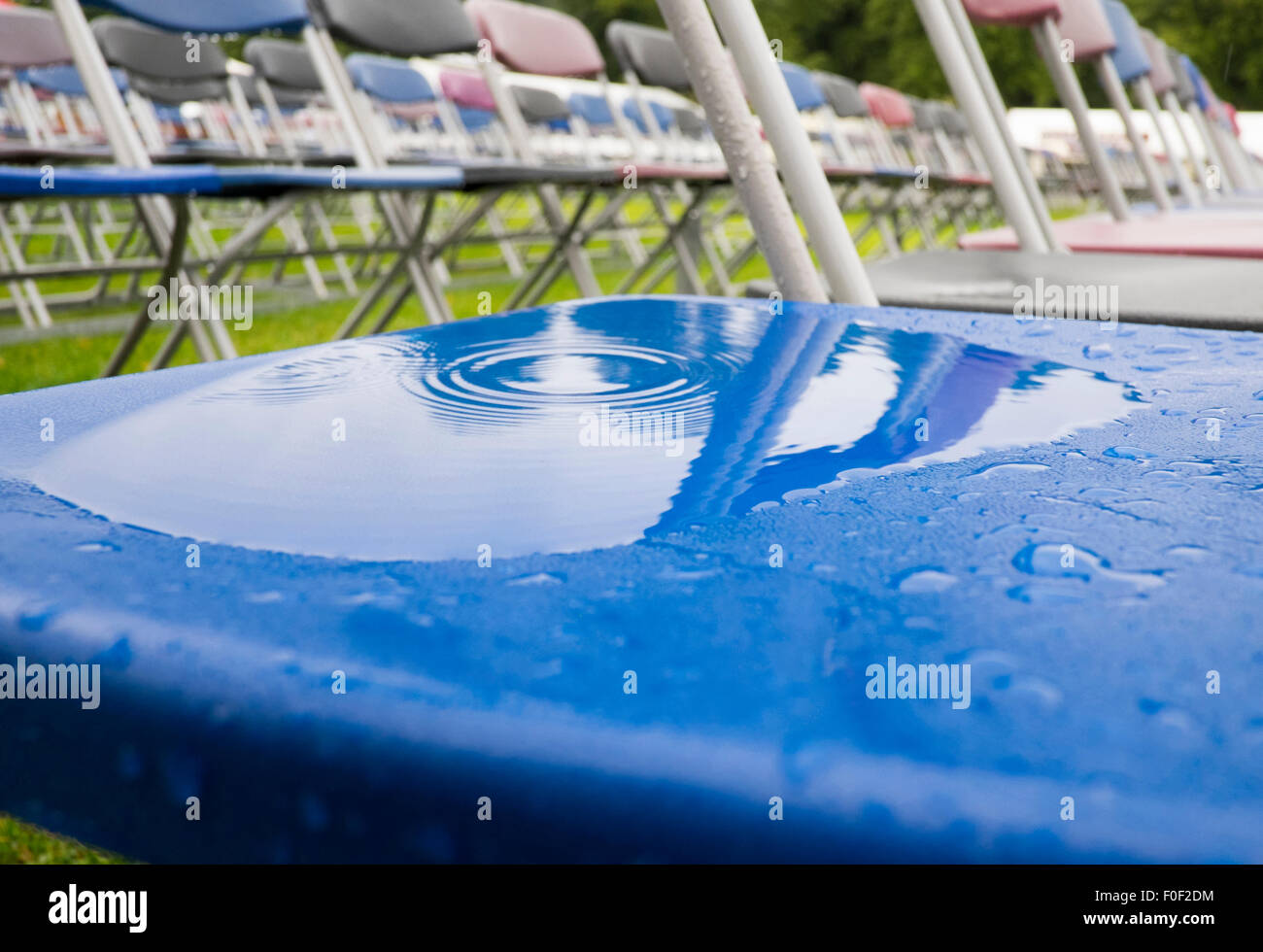 A puddle during rain on a seat at the 128th Shrewsbury Flower Show ...