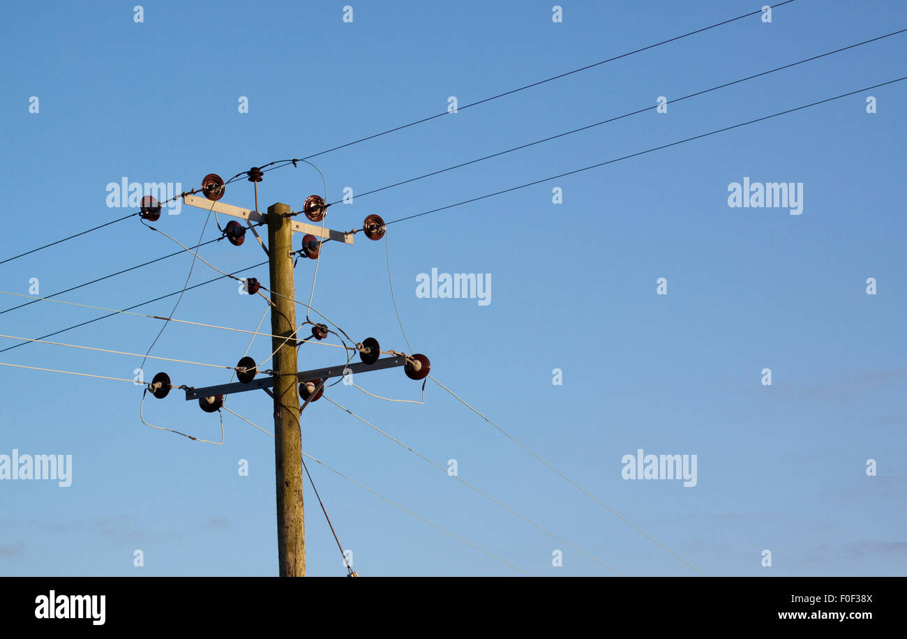 Electric power pole against a beautiful blue sky Stock Photo - Alamy