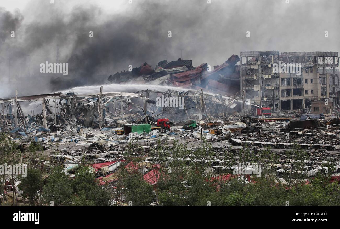 Tianjin, China. 14th Aug, 2015. Firefighters work at the warehouse ...