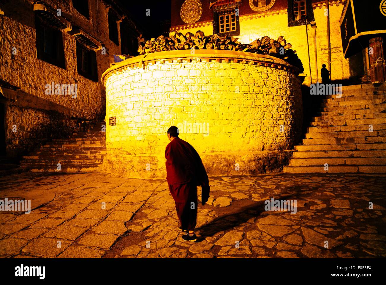 Lhasa, China's Tibet Autonomous Region. 14th Aug, 2015. A monk walks at ...