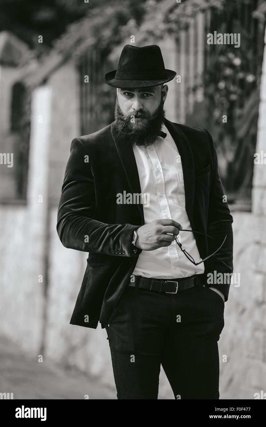 rich man with a beard, thinking about business Stock Photo - Alamy