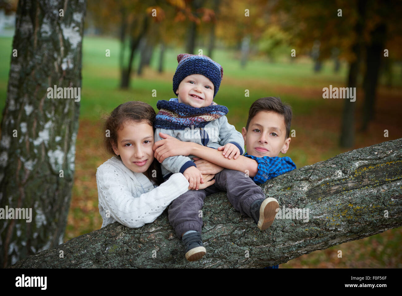 happy children in autumn park Stock Photo - Alamy