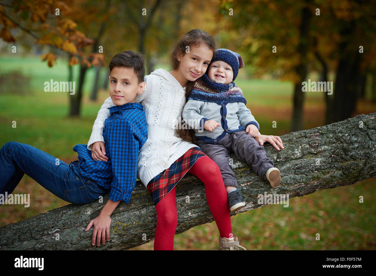 happy children in autumn park Stock Photo - Alamy