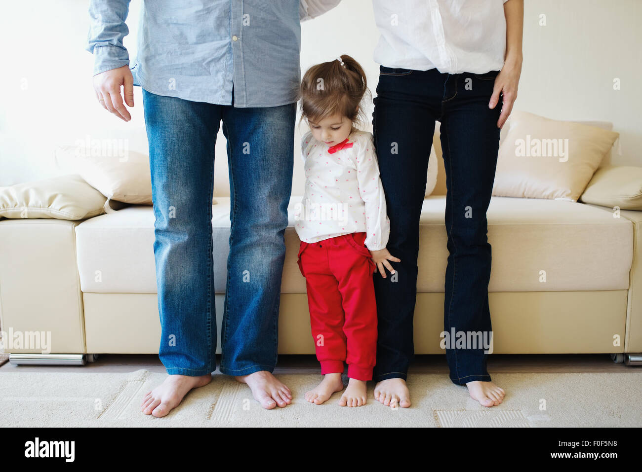 Child hugging parent leg hi-res stock photography and images - Alamy