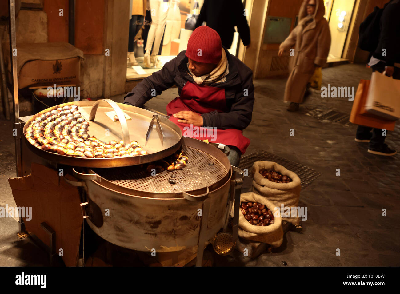 Chestnut seller roasts and sells chestnuts on the street of Via ...