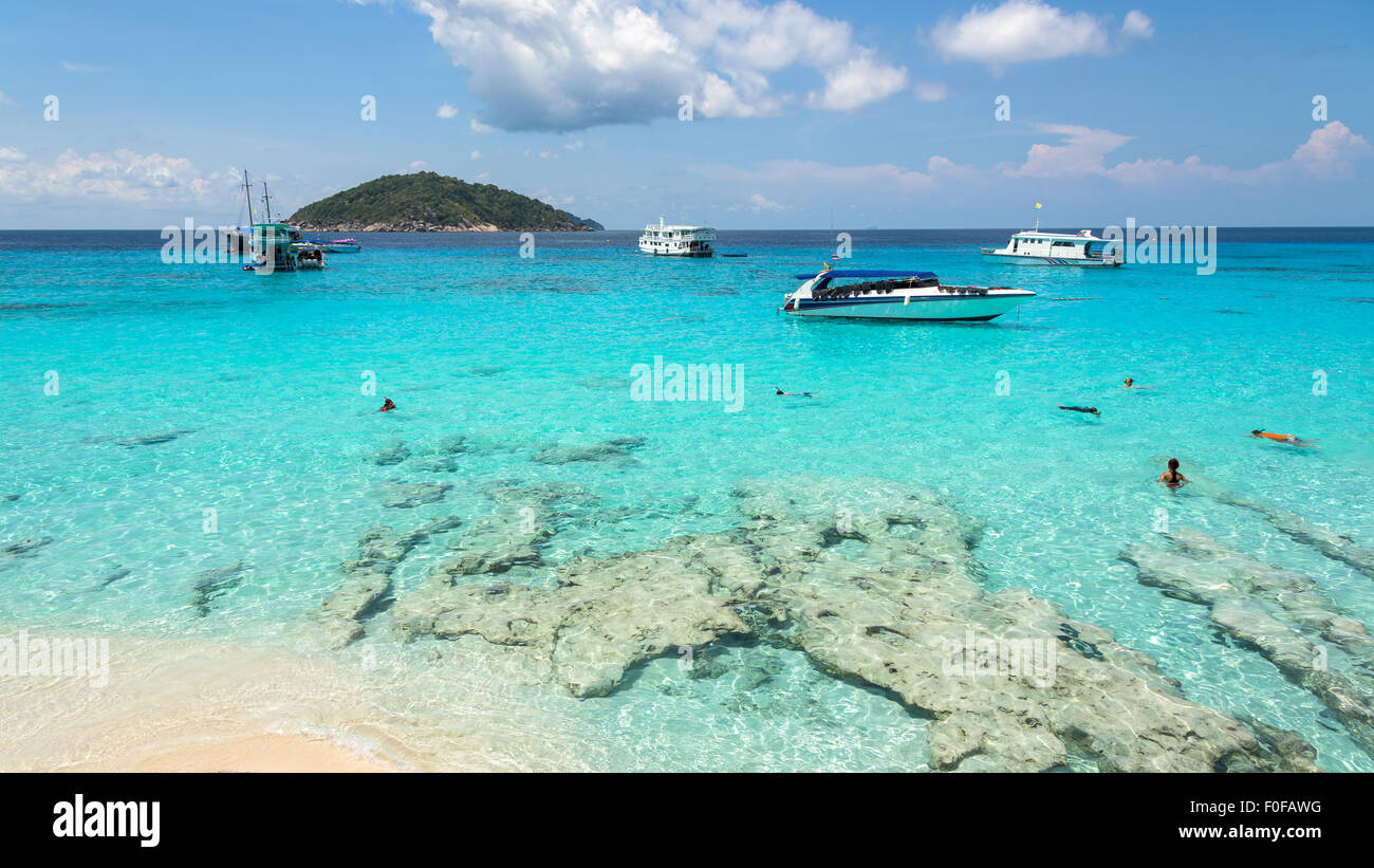Beautiful landscapes of sky over the sea and tourists on beach in the ...