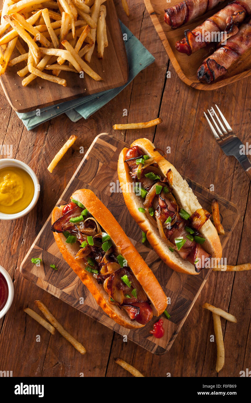 Homemade Bacon Wrapped Hot Dogs with Onions and Peppers Stock Photo - Alamy