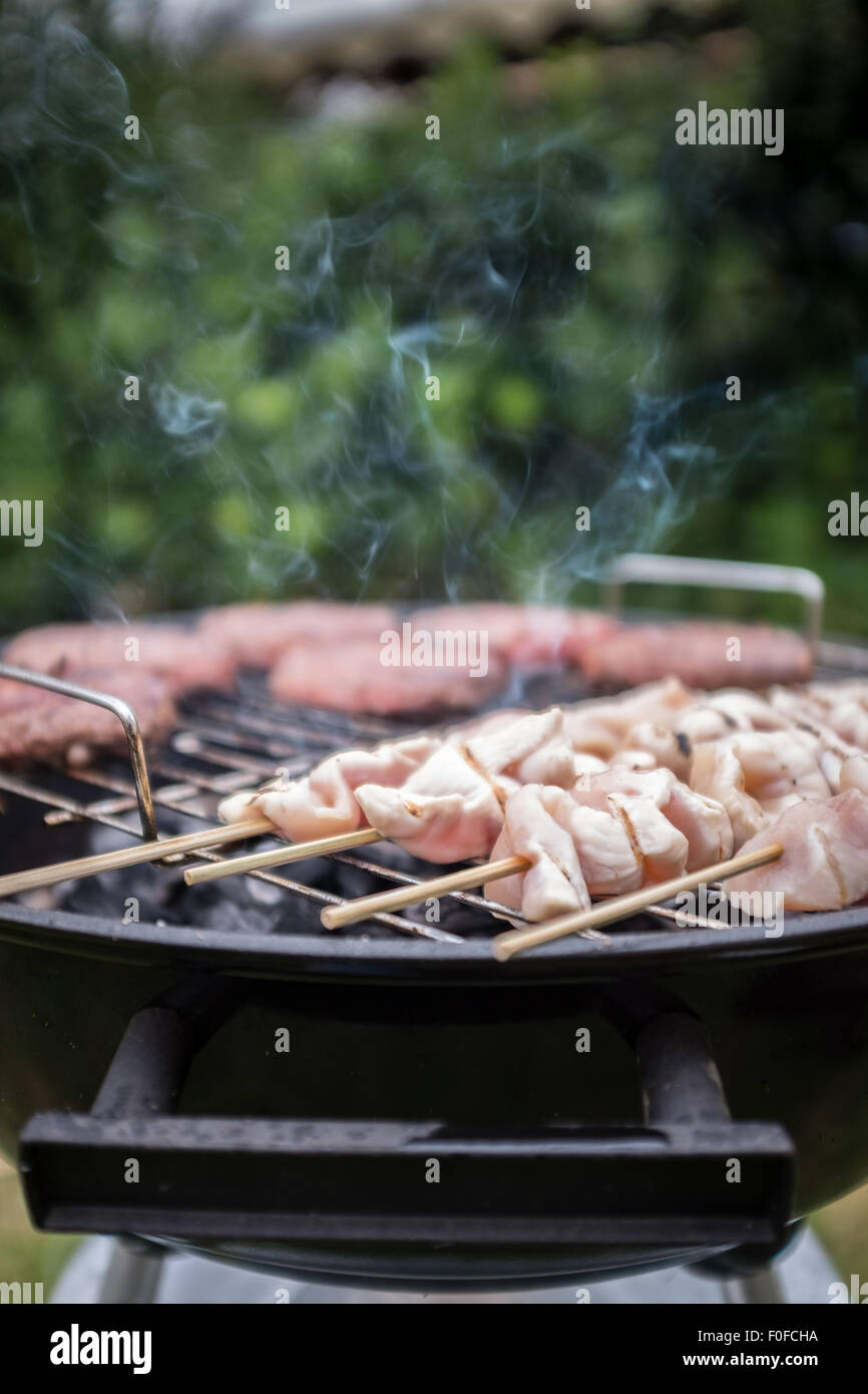 Meat cooking on an outdoor barbeque Stock Photo - Alamy