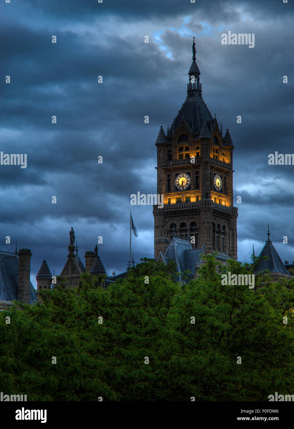Clock tower and flag of the United States of America are seen framed ...