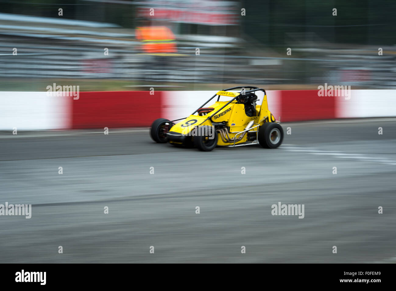 Car 9 speeds down the straightaway Stock Photo - Alamy