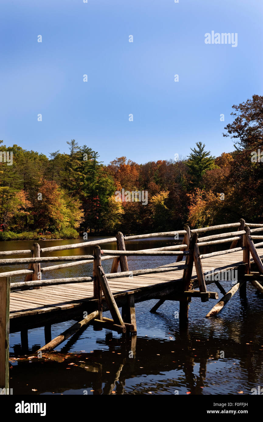 Wooden bridge over lake in autumn Stock Photo - Alamy
