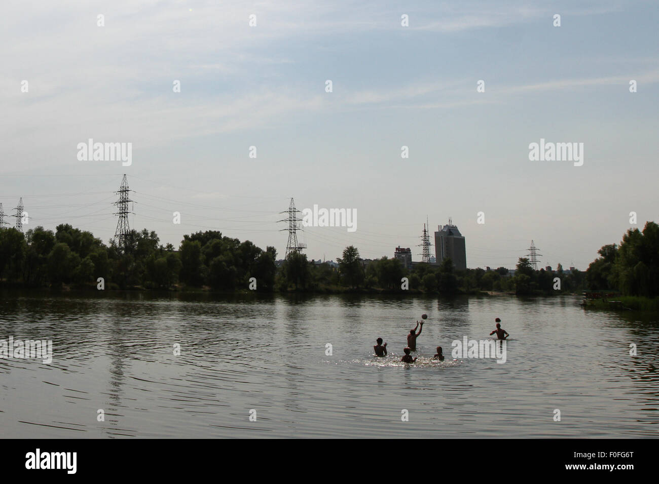 Kiev, Ukraine. 13th Aug, 2015. People play a ball in Verbne lake in ...