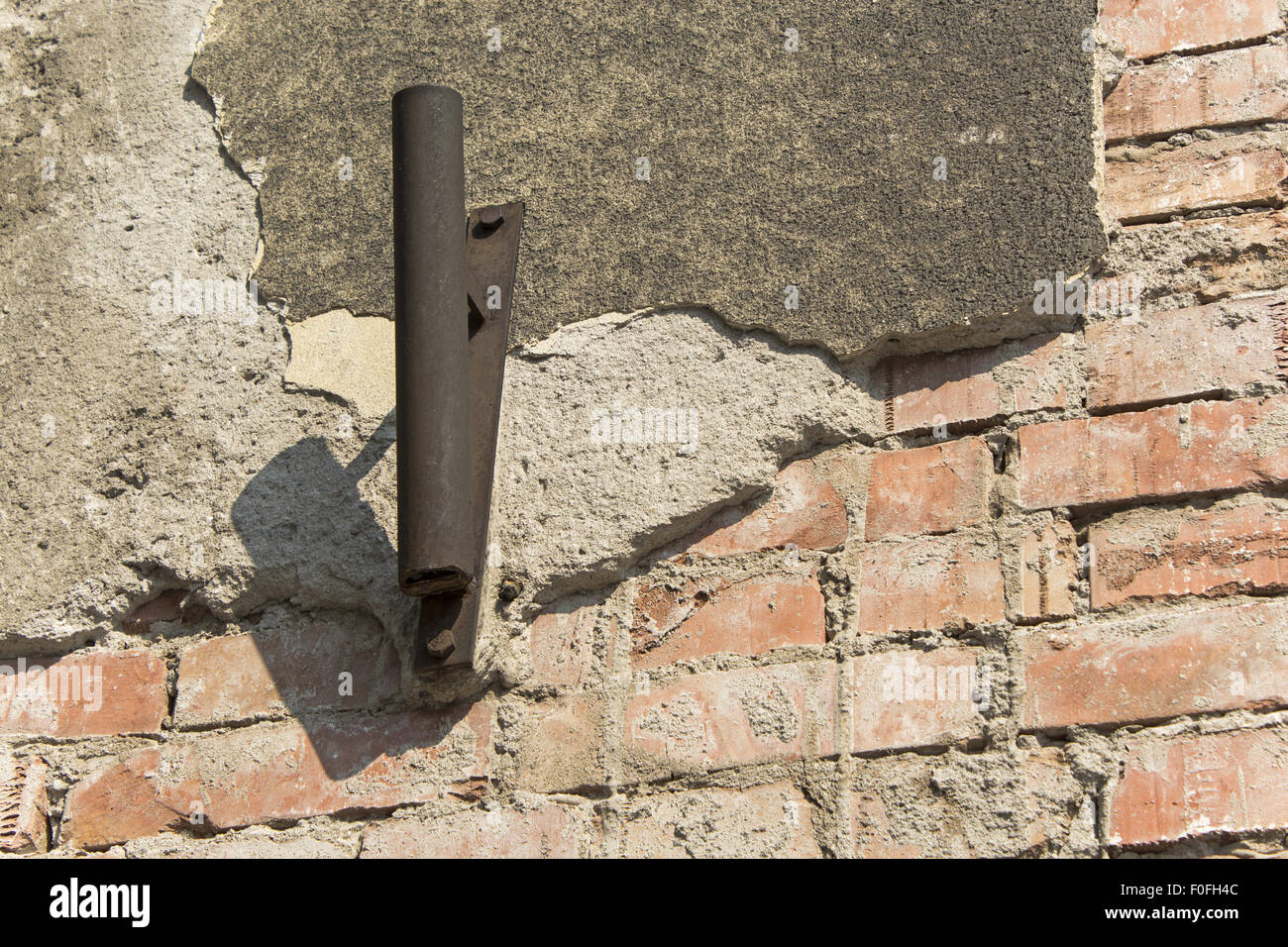 Flag holder on brick background Stock Photo - Alamy