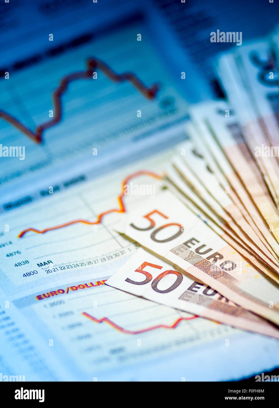 Financial paper with business page and Euro notes Stock Photo - Alamy