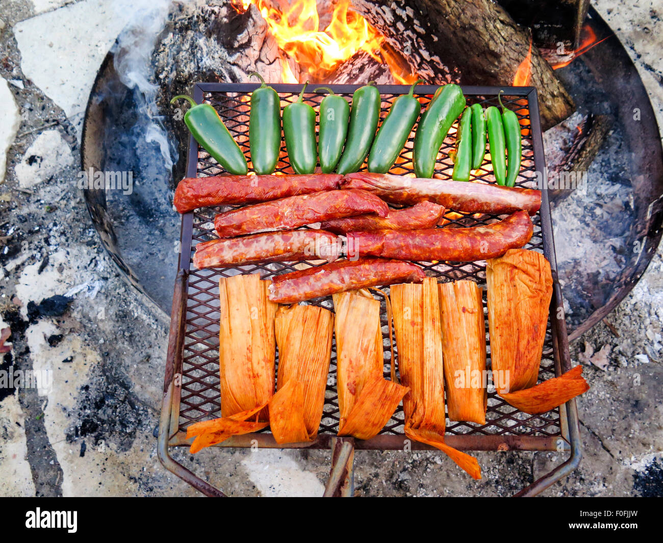 Cooking over wood fire Stock Photo - Alamy
