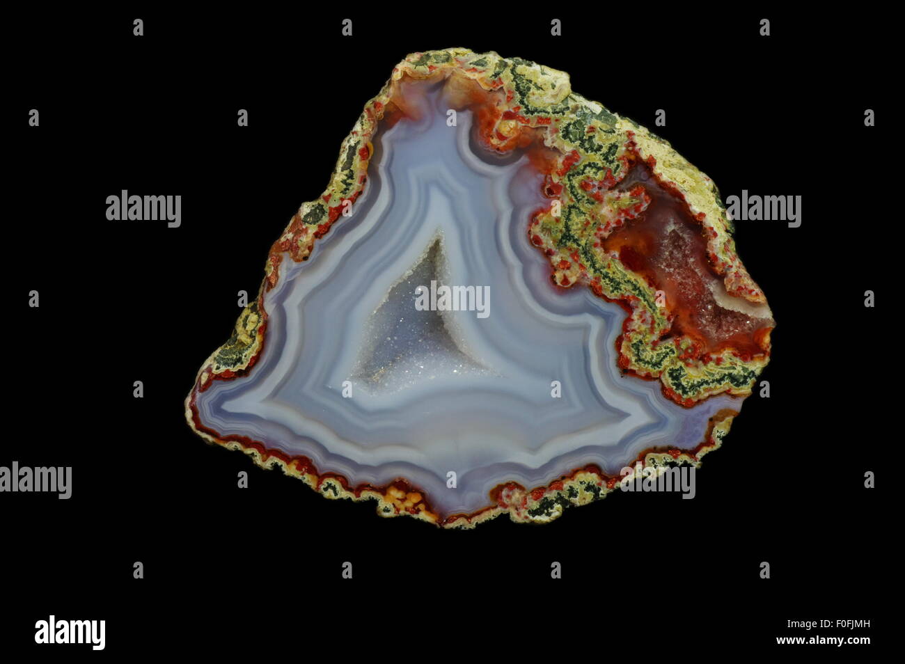 Agate, a cross section of agate stone with geode on a black background ...