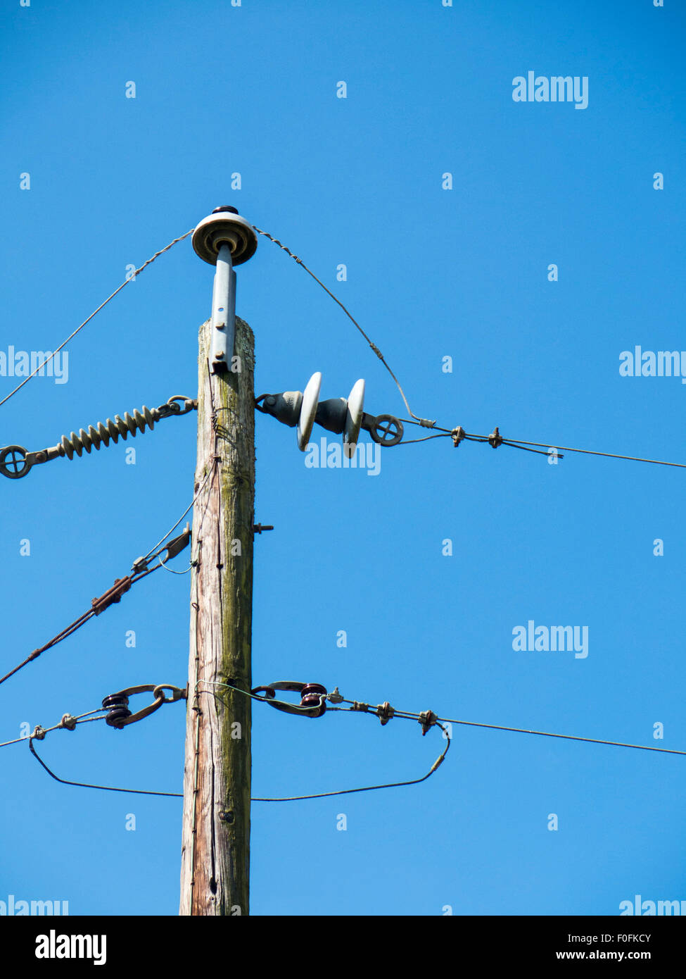 power lines and insulators on a wooden power pole Stock Photo: 86396379 ...