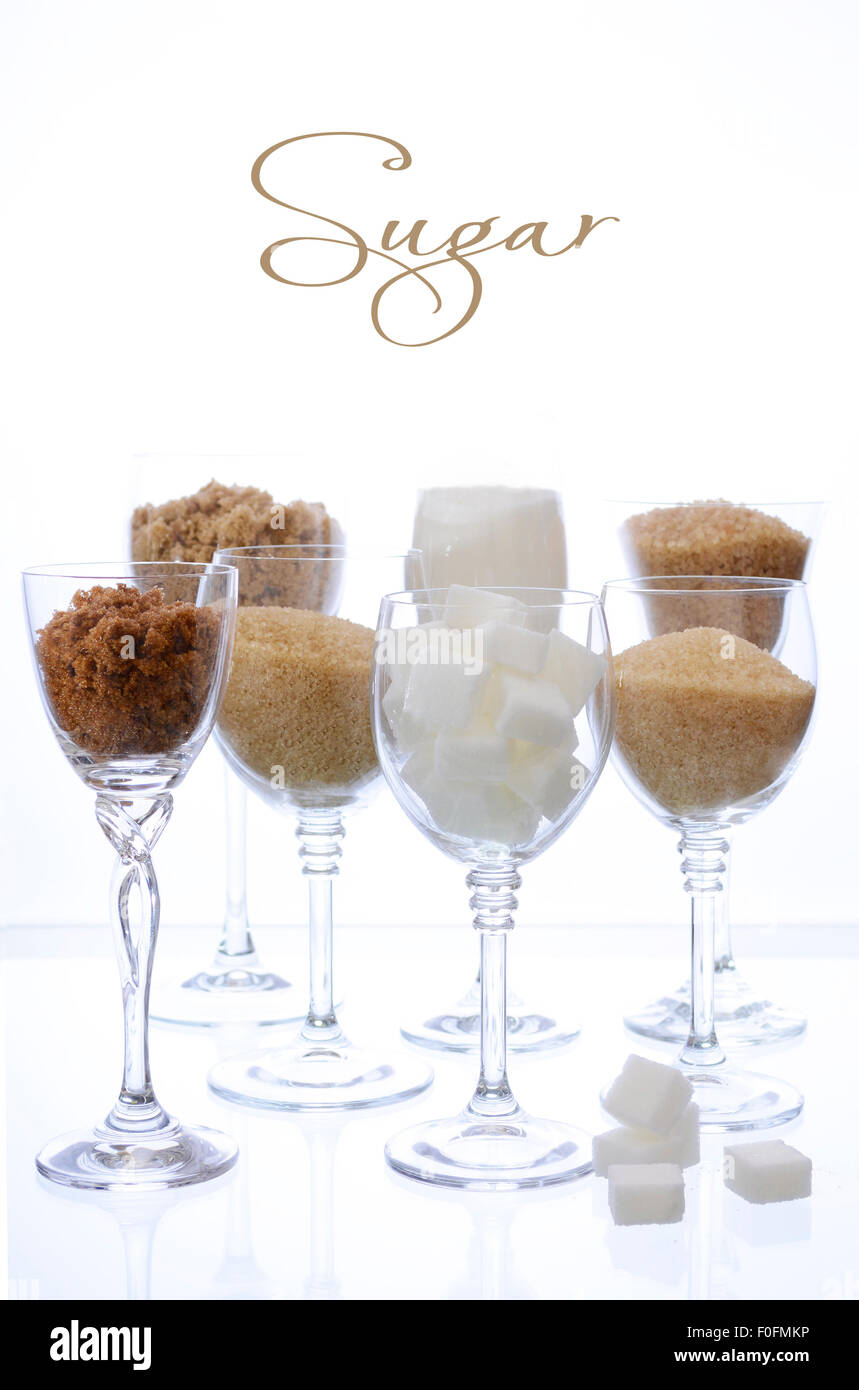 Different types of sugar including white, brown, dark brown, demerara ...