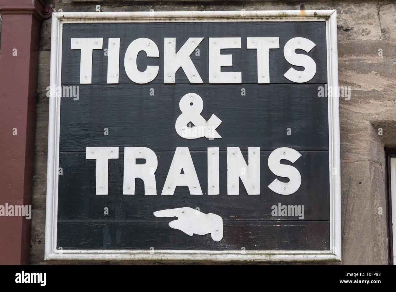 Old Railway sign saying Tickets & Trains Stock Photo - Alamy