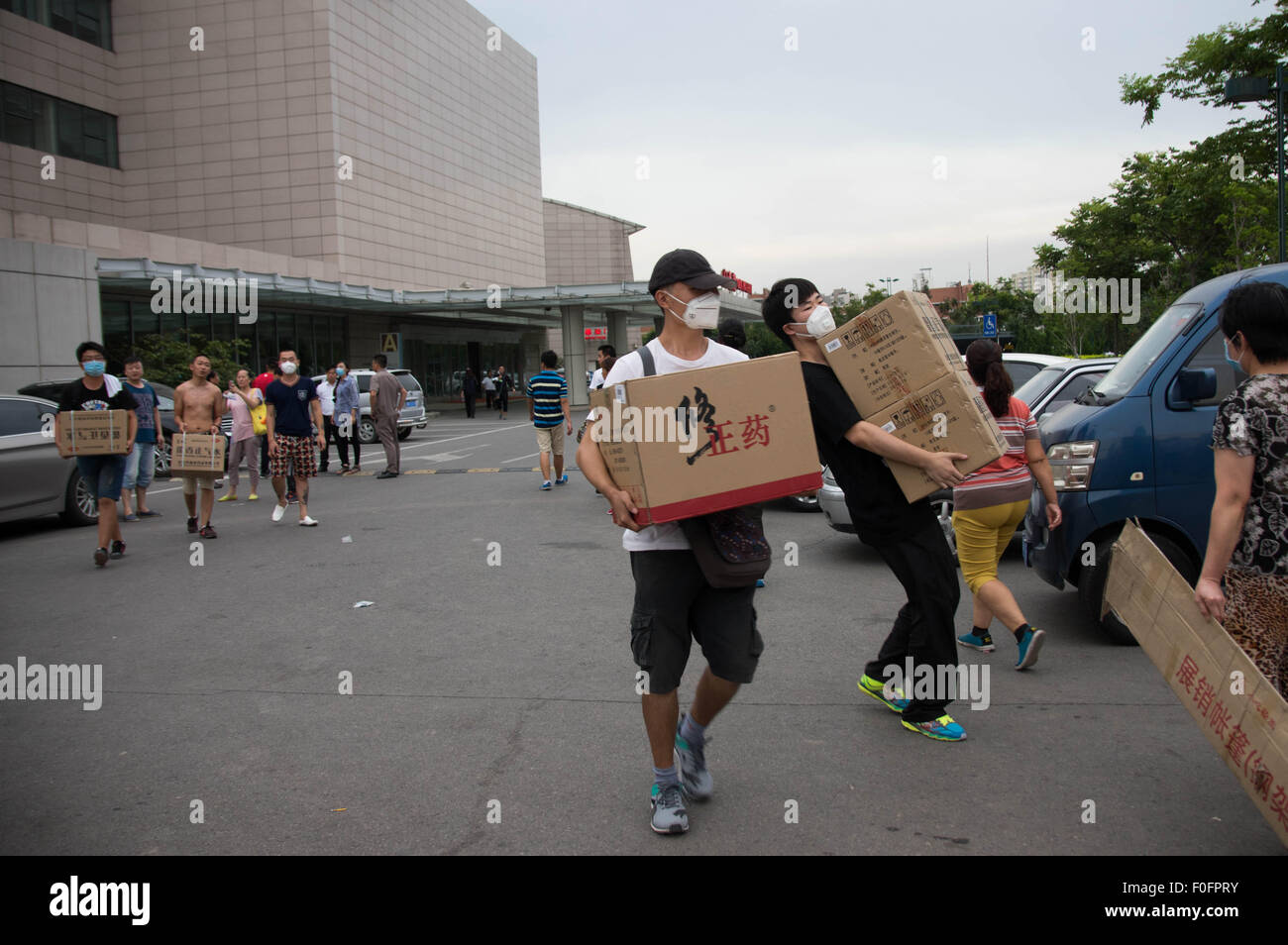 China. 14th Aug, 2015. Volunteers seen carrying aid from around the ...