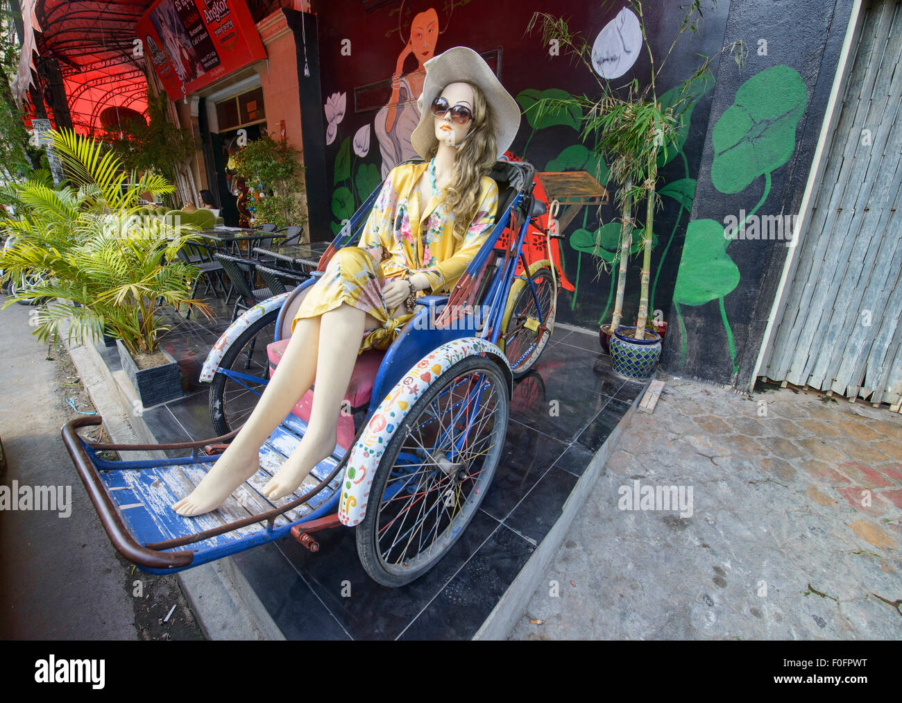 Cyclo rickshaw outside a bar in Phnom Penh, Cambodia Stock Photo - Alamy