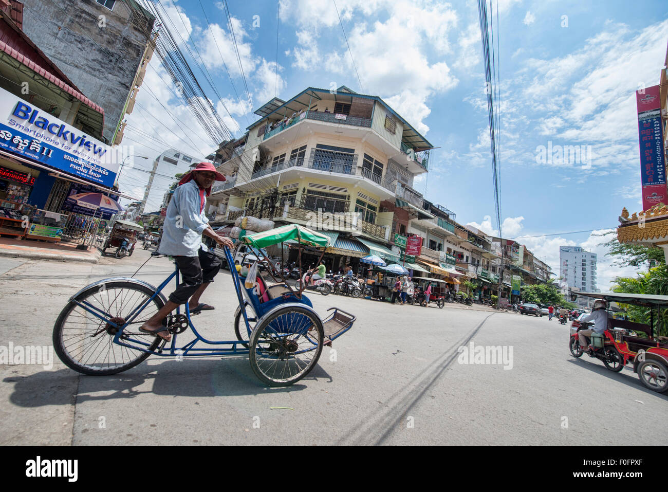 Cyclo driver in Phnom Penh, Cambodia Stock Photo - Alamy