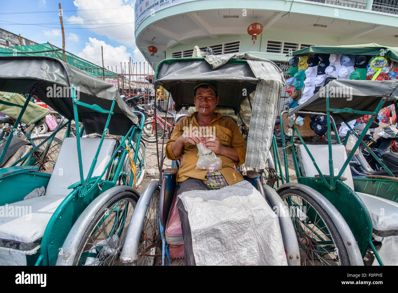 Cyclo driver in Phnom Penh, Cambodia Stock Photo - Alamy