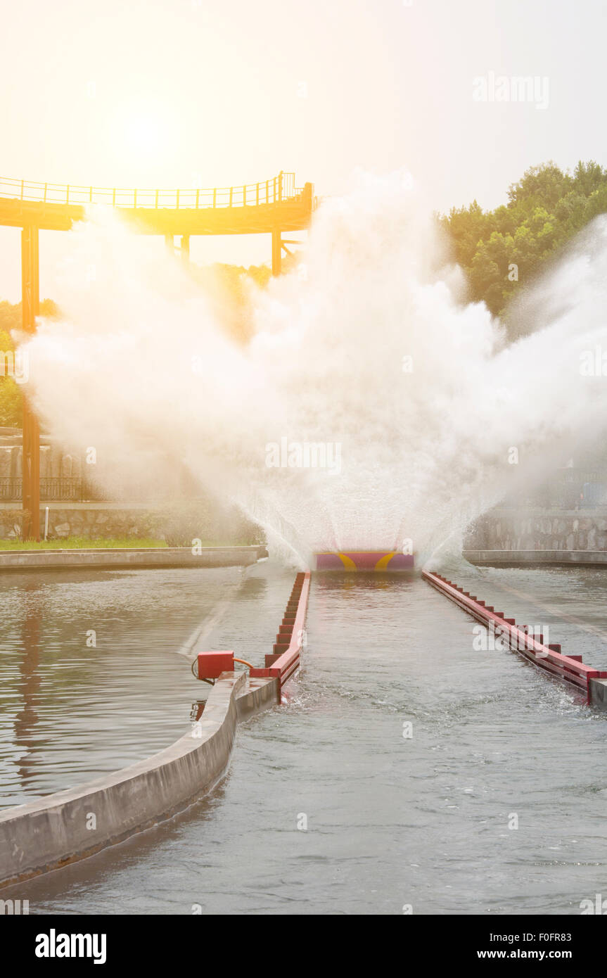 Water slide boat park at playground Stock Photo - Alamy