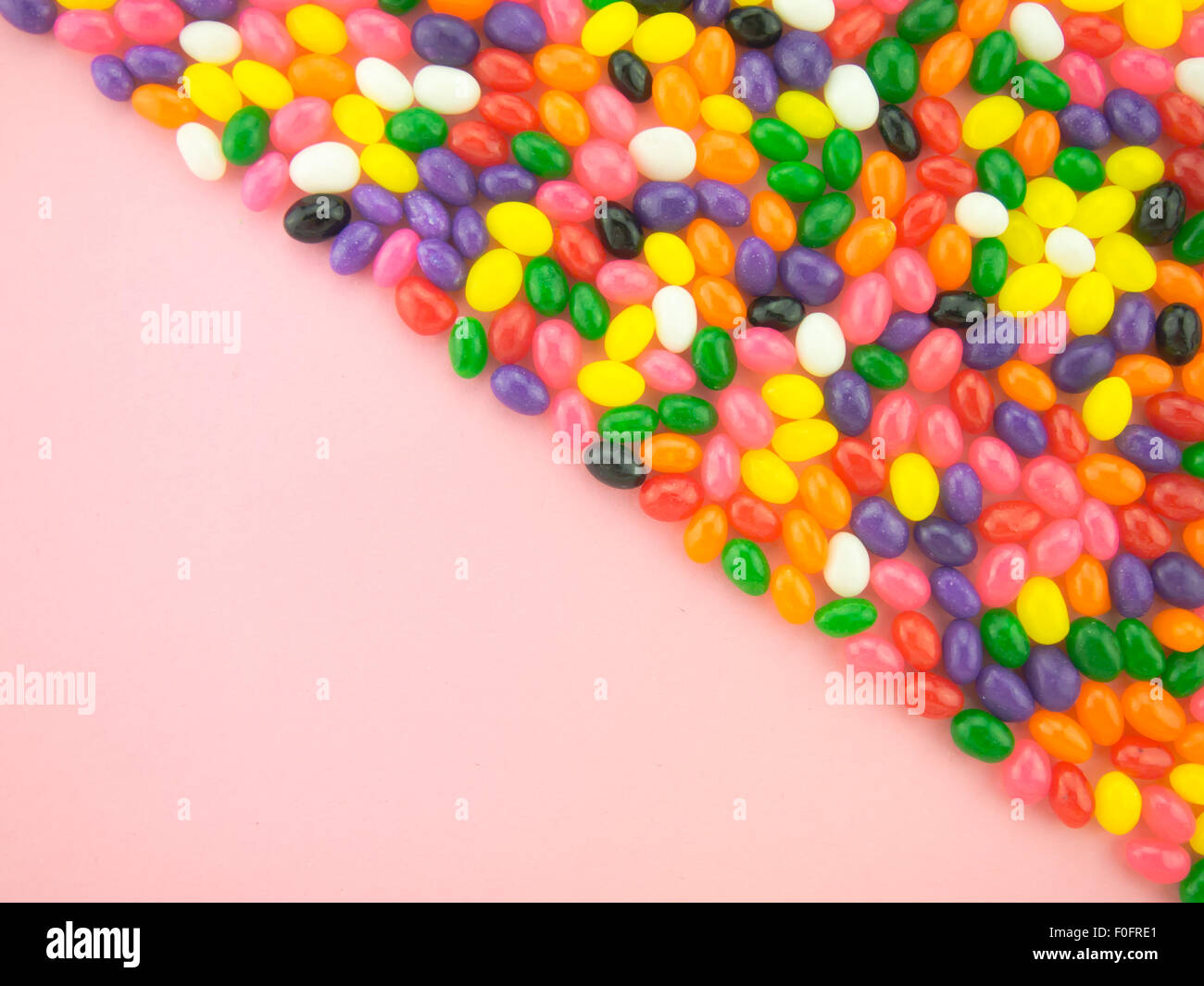 Frame and background made of colorful jelly beans Stock Photo - Alamy