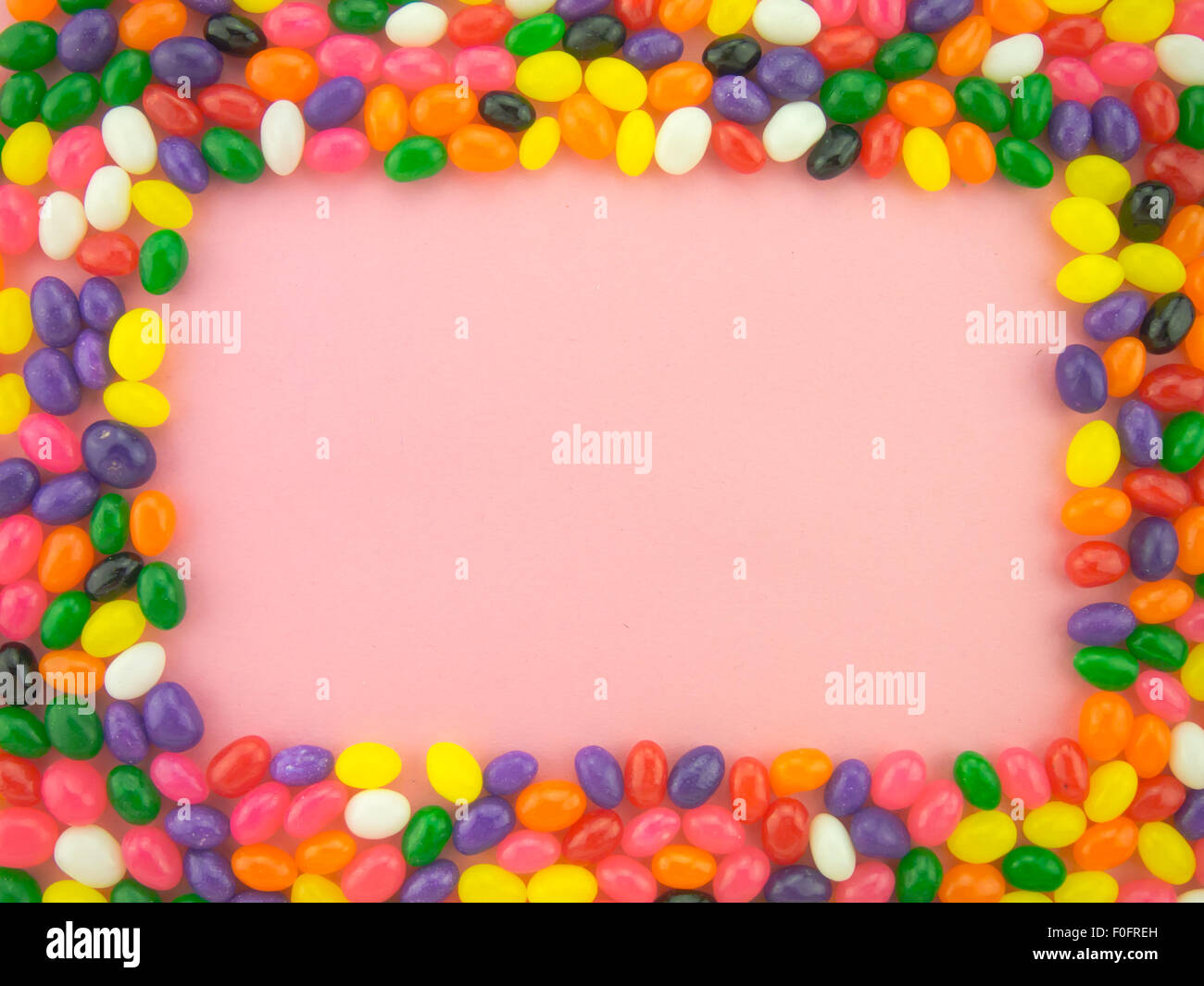 Frame and background made of colorful jelly beans Stock Photo - Alamy