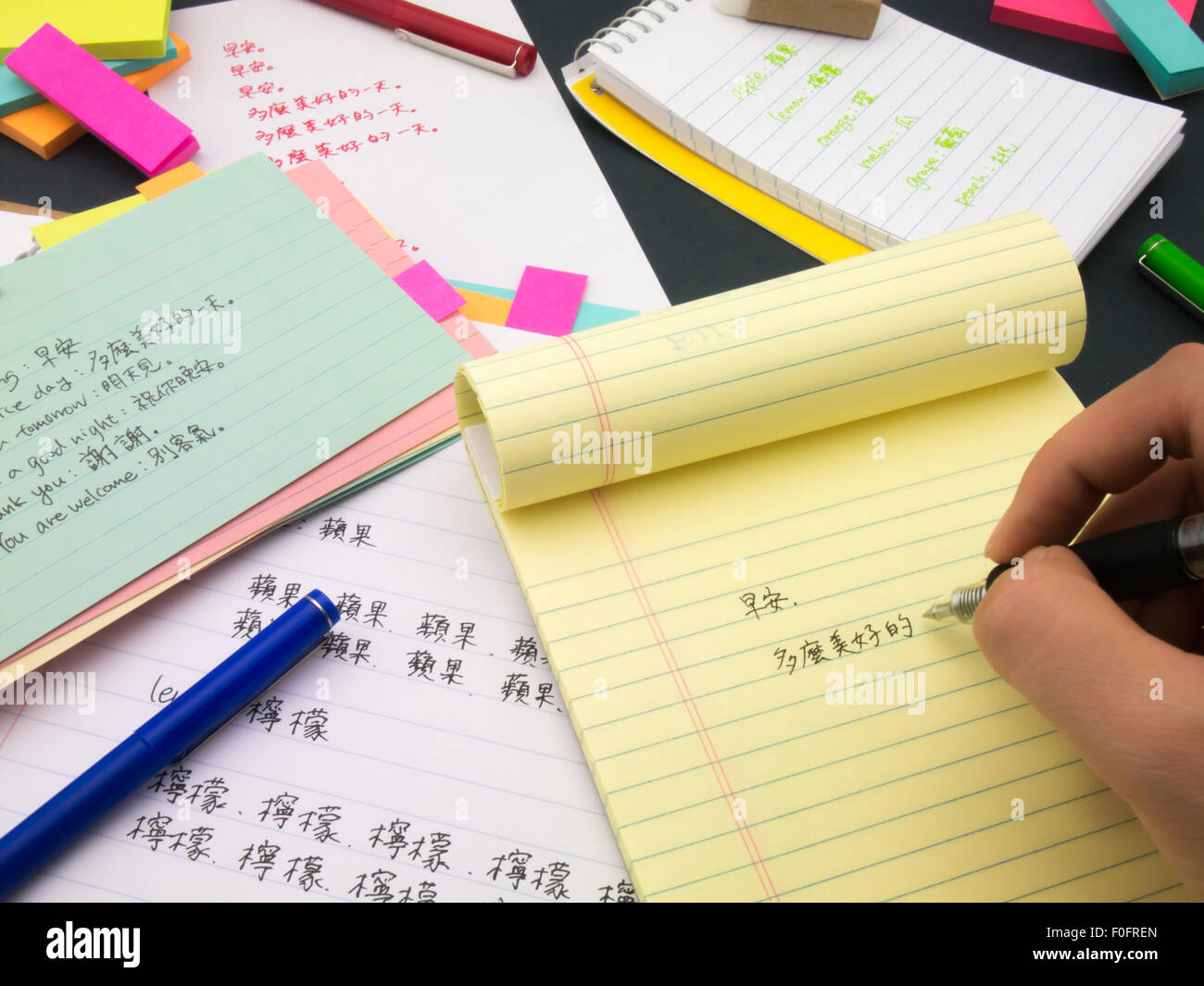 Writing new words again and again to learn new language Stock Photo - Alamy