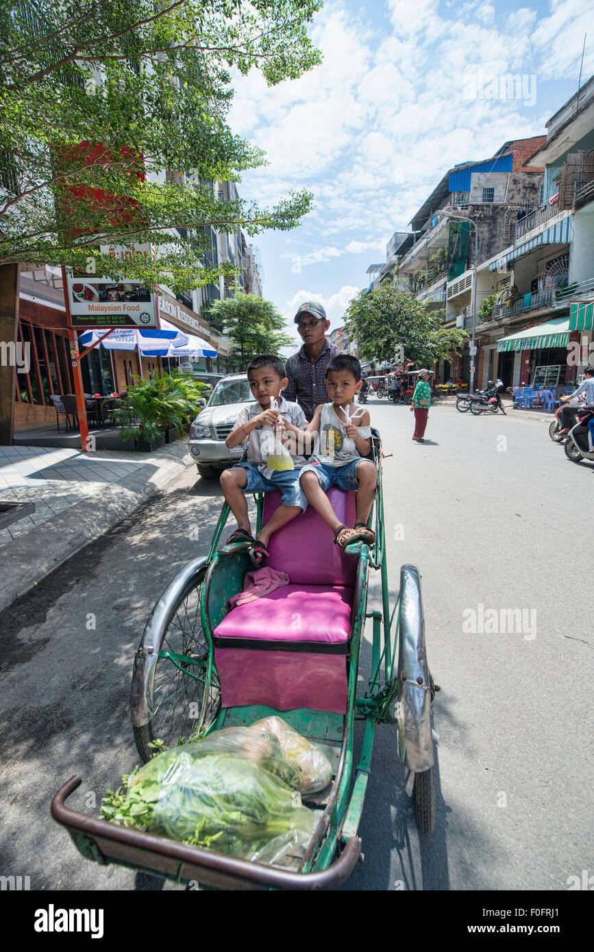 Twins in a cyclo rickshaw in Phnom Penh, Cambodia Stock Photo - Alamy