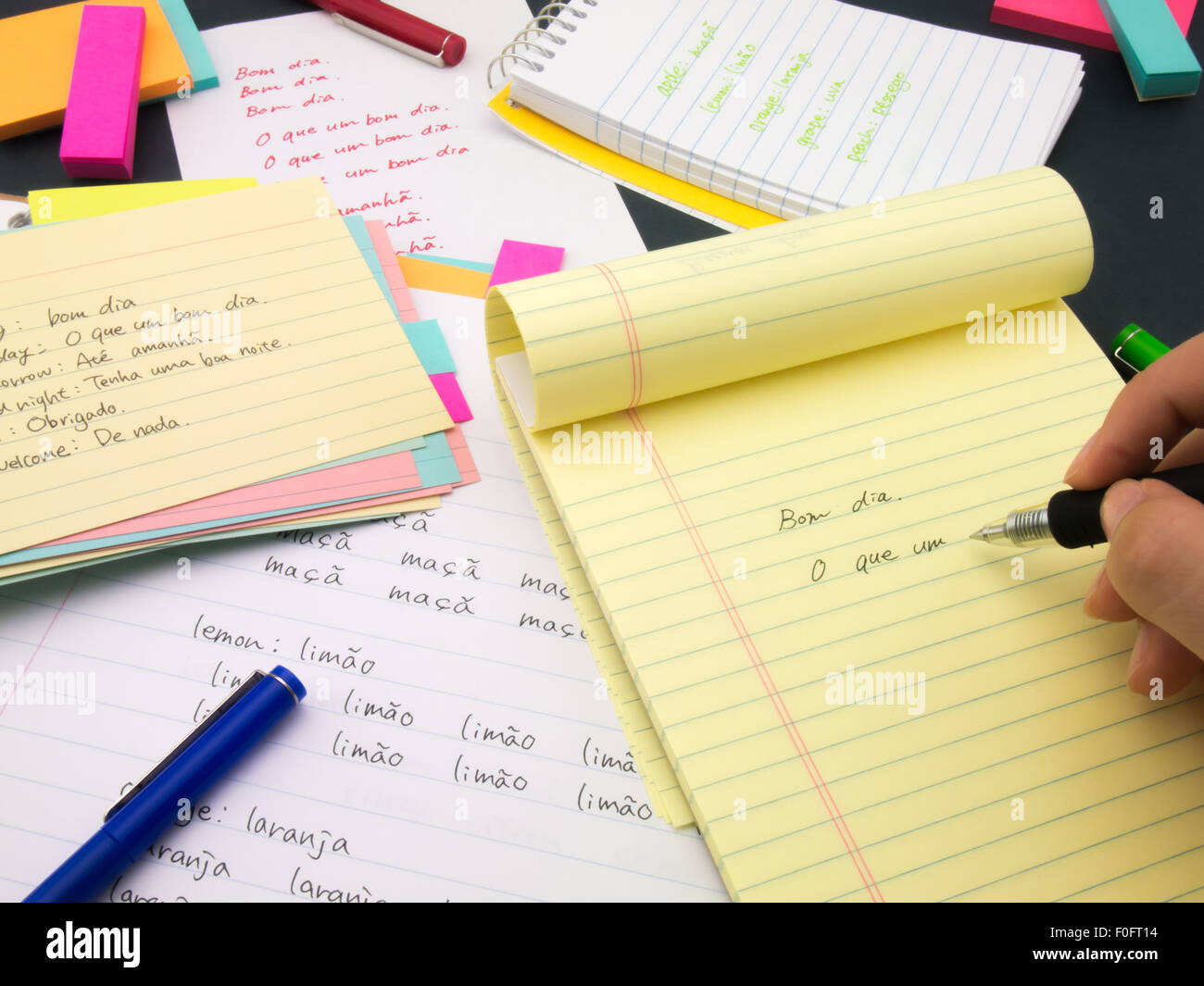 Writing new words again and again to learn new language Stock Photo - Alamy