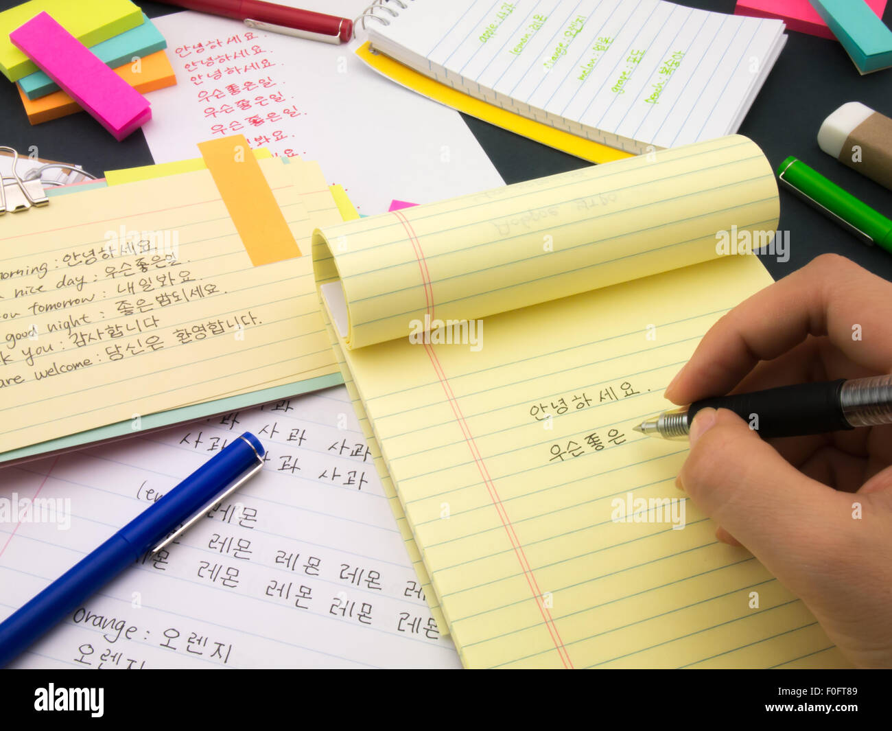 Writing new words again and again to learn new language Stock Photo - Alamy
