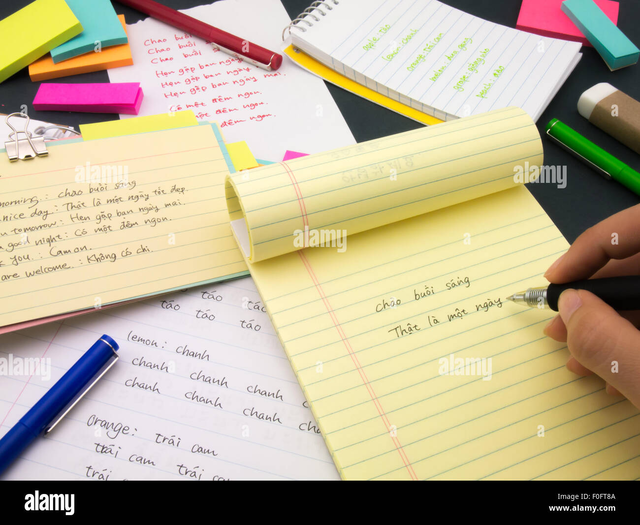 Writing new words again and again to learn new language Stock Photo - Alamy