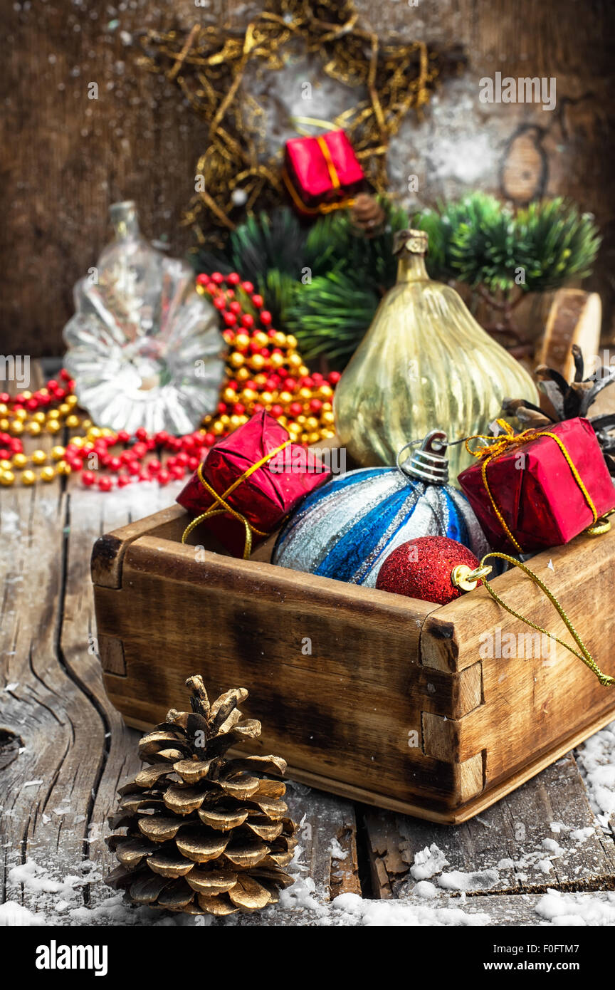Wooden box filled with old fashion Christmas decorations.Photo tinted ...