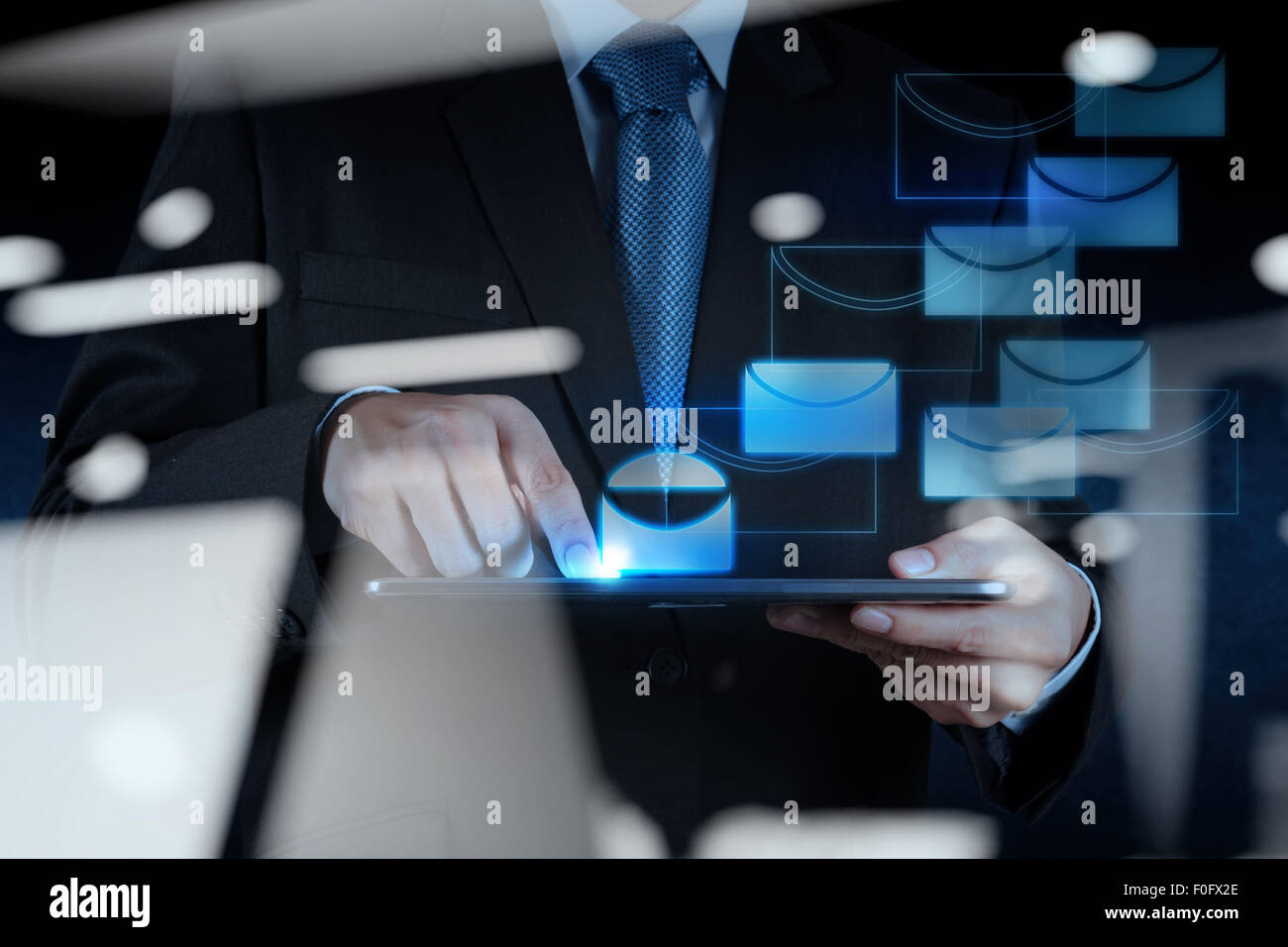 double exposure of businessman hand use smart phone computer with email ...