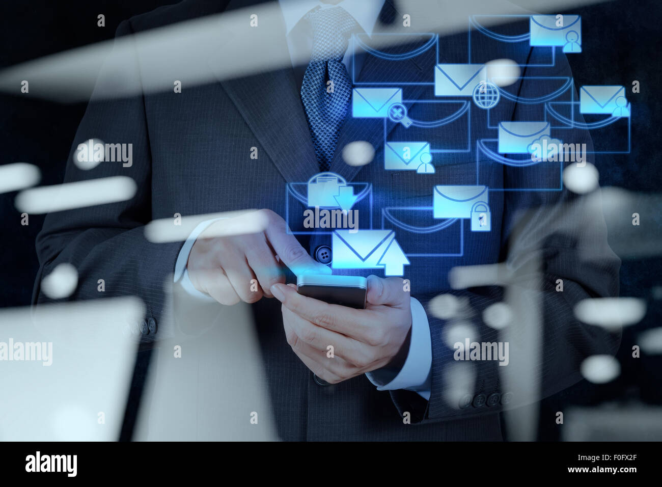 double exposure of businessman hand use smart phone computer with email ...