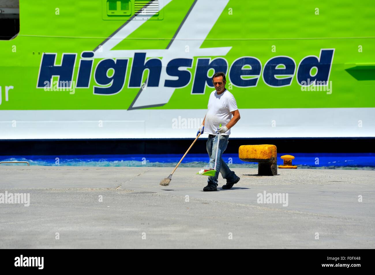 A worker sweeping the port harbor area with a Cosmote highspeed 4 ...