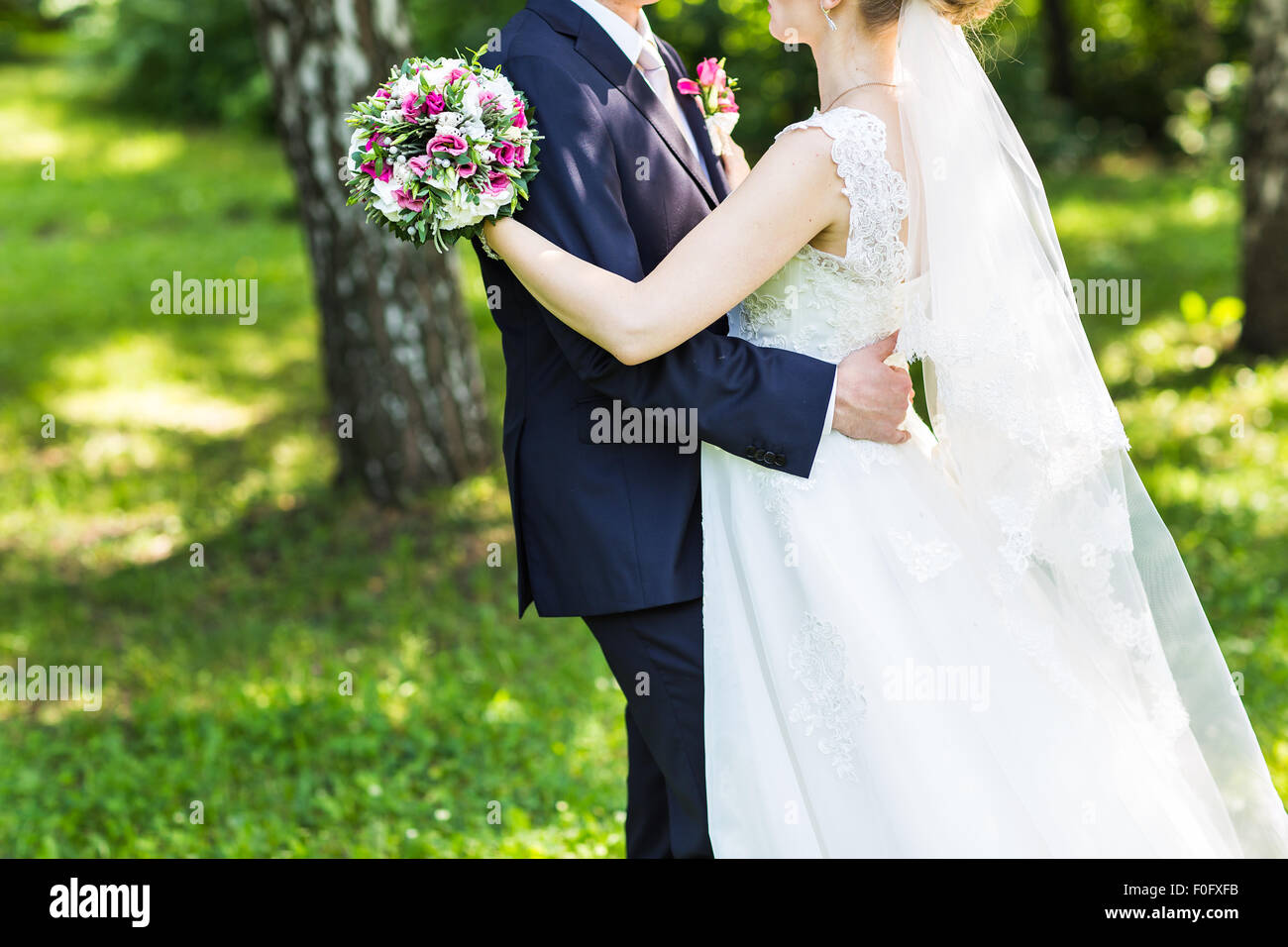 wedding couple hugging Stock Photo - Alamy