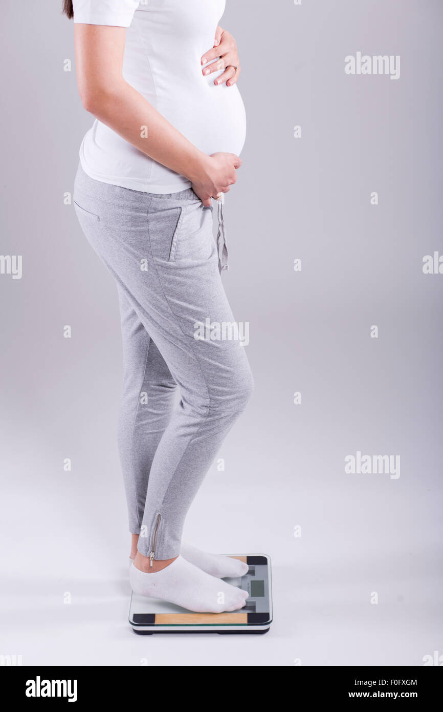 Woman checking weight hi-res stock photography and images - Alamy