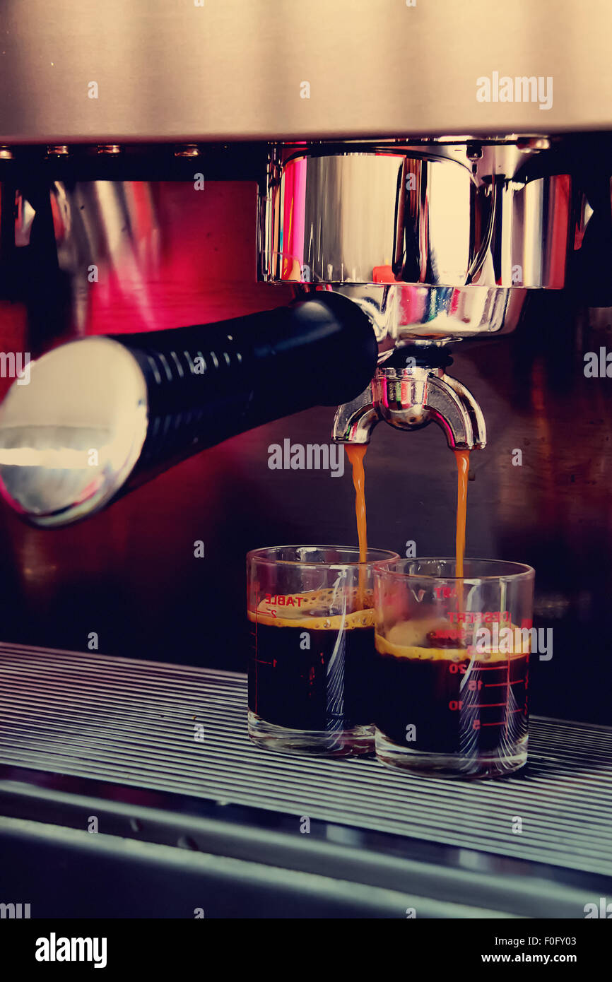 Process of preparation of coffee, a closeup.coffee machine in a cafe ...