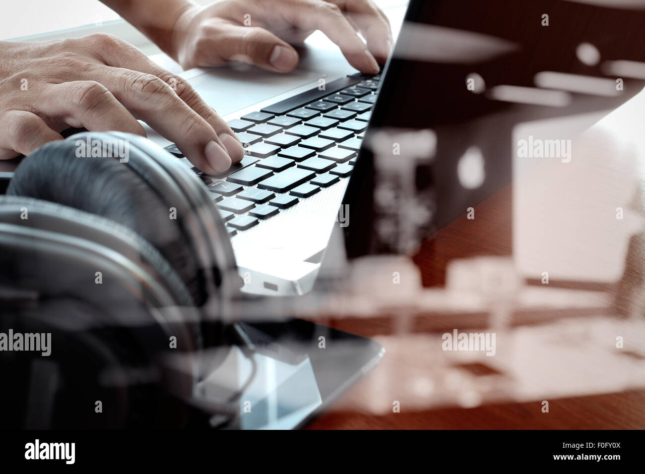 composing music concept-workspace of musician with headphone and laptop ...