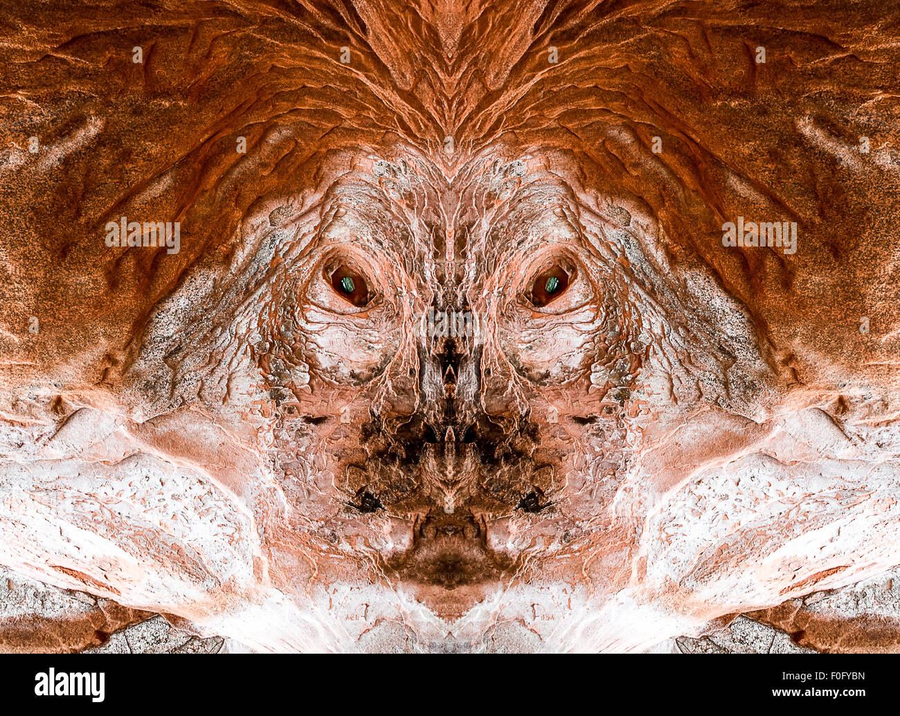 alien face on the wall of sandstone Stock Photo - Alamy
